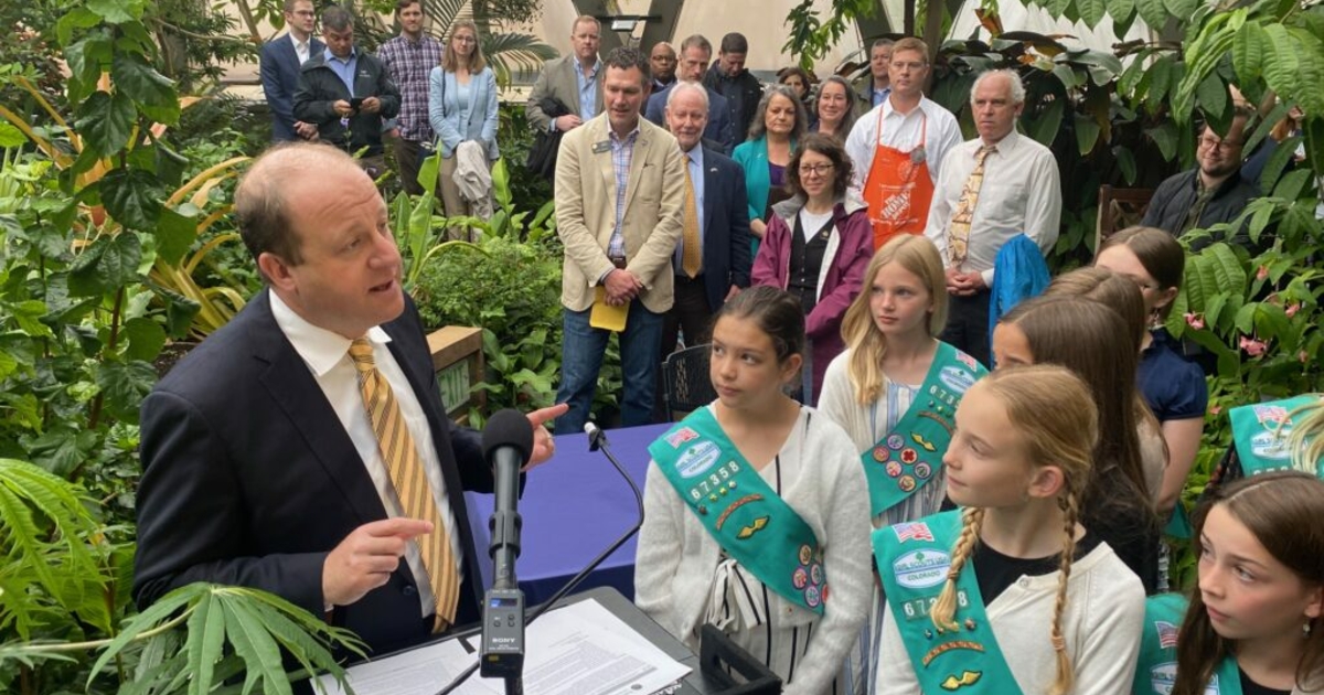 Gov. Polis signs slate of clean energy measures, utility regulation ...